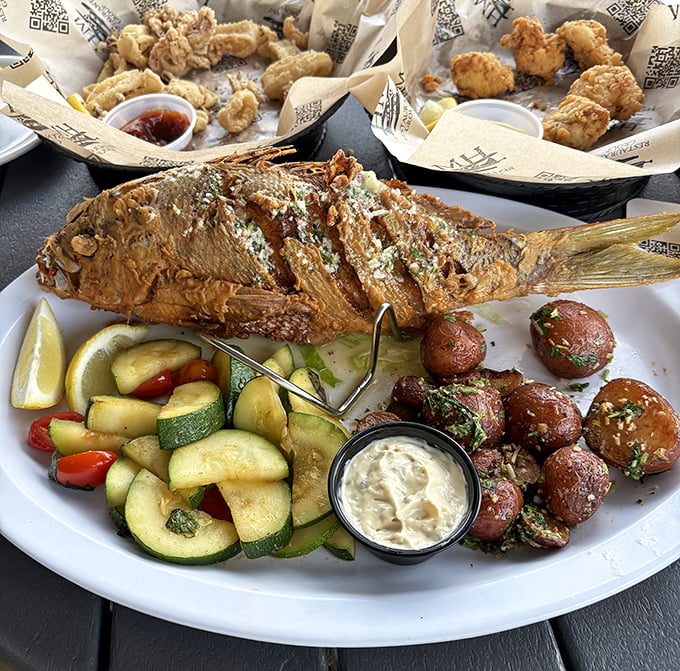 Beer-battered perfection with sides that understand their supporting role – this is comfort food royalty.