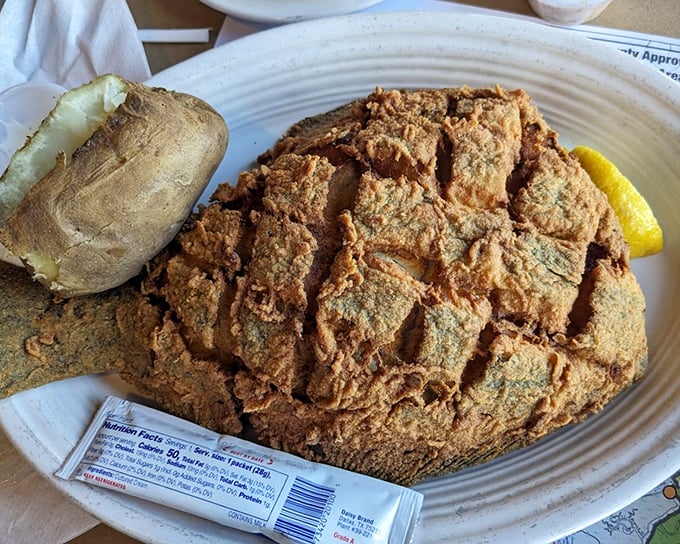 This fried flounder is the Dolly Parton of seafood—unpretentious, generous in portion, and absolutely unforgettable with its golden, crispy exterior.