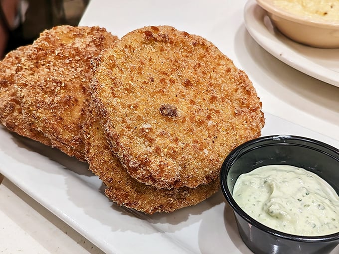 Fried green tomatoes with a Southern drawl—crispy, tangy discs that make you wonder why we ever bother eating them red.