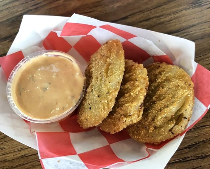 These fried green tomatoes aren't just Southern classics; they're crispy golden discs of tangy delight that disappear faster than you can say "y'all."