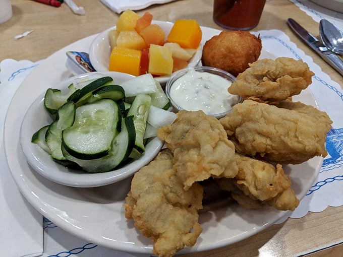 Golden-fried oysters and fresh sides—proof that simplicity, when executed perfectly, beats culinary gymnastics every time.