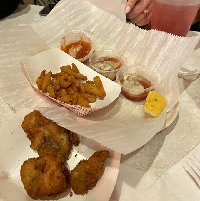 Golden-fried oysters and crispy fries—proof that sometimes the simplest pleasures are the most profound culinary experiences.