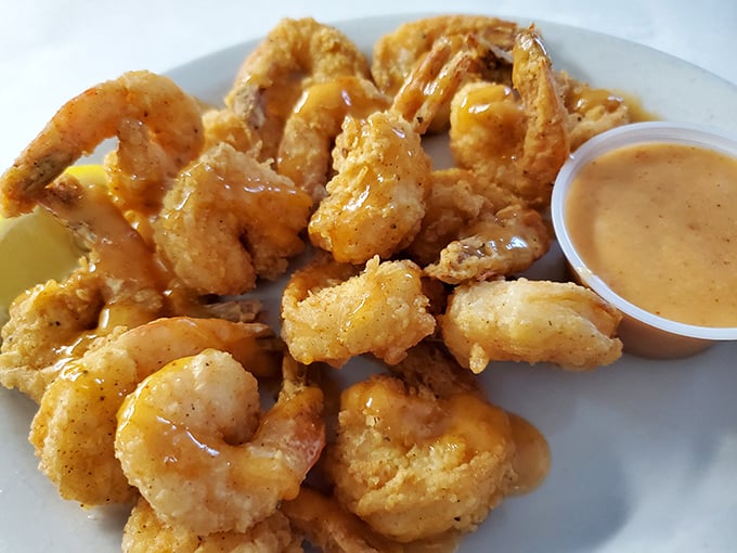 These fried shrimp aren't just golden – they're the Olympic gold medalists of the seafood world, with a dipping sauce that deserves its own medal ceremony.