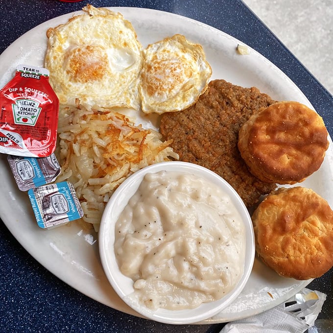 Southern hospitality on a plate – crispy country-fried steak with creamy gravy and golden hash browns that would make any grandmother nod in approval.