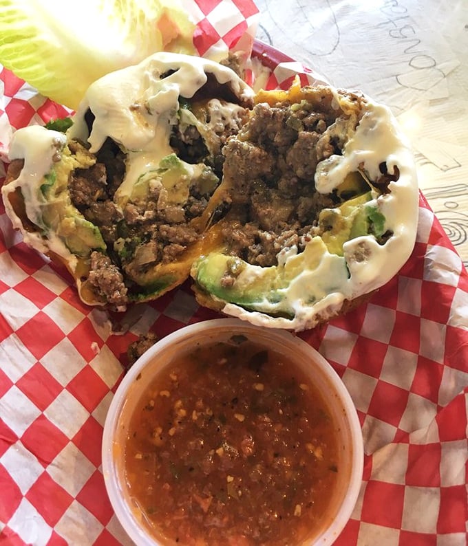 Fried avocado—because Texas figured out how to improve perfection. Crispy exterior giving way to creamy green goodness, with a side of salsa that kicks like a spirited longhorn.