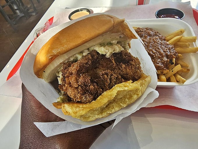 The fried catfish sandwich arrives like Southern comfort on a bun—crispy, golden-brown perfection that would make your grandma both proud and jealous.
