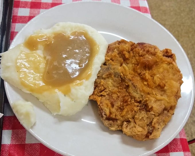 Country fried steak with gravy and mashed potatoes—the kind of plate that makes you want to hug the cook.
