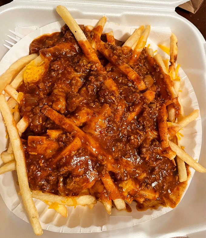 Chili cheese fries that don't mess around—crispy potatoes swimming in a sea of beefy, spicy goodness that demands to be devoured.