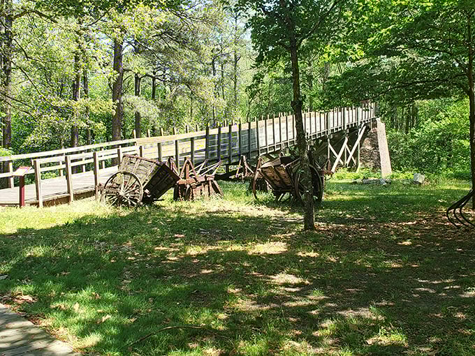 This wooden bridge and antique farm equipment at Furnace Town transport visitors back to the 19th century—living history you can touch and traverse.