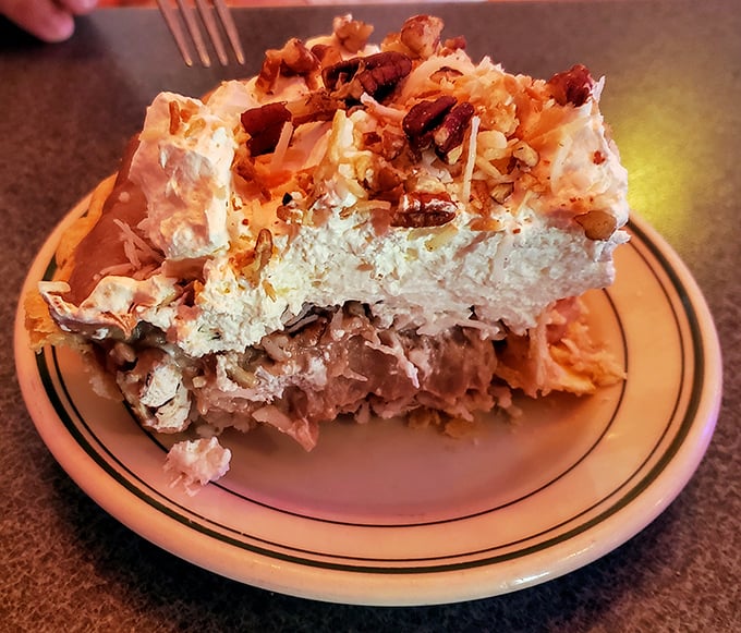 Layer upon heavenly layer of creamy, coconutty bliss. This isn't just dessert—it's the reason elastic waistbands were invented.