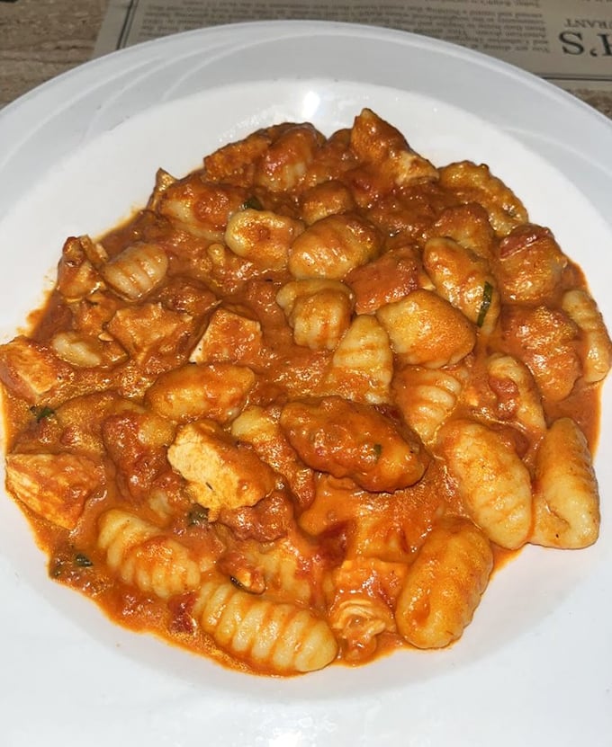 Pillowy gnocchi swimming in a sea of red sauce. Each bite is like a warm hug from the Italian grandmother you wish you had.