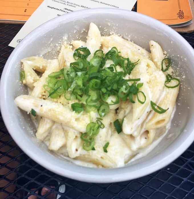 Mac and cheese for grown-ups. Those green onions aren't just garnish—they're the perfect sharp counterpoint to the creamy, cheesy pasta beneath.