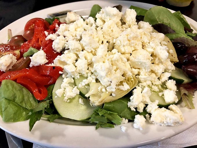 A Greek salad that makes you wonder if Columbus secretly has a Mediterranean coastline—feta crumbles like delicious snowdrifts over fresh vegetables.