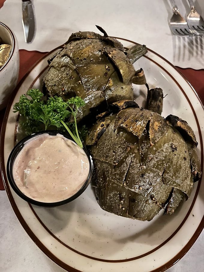 Grilled artichokes that make you question why you'd eat them any other way—charred, tender, and paired with a dipping sauce worth bottling.
