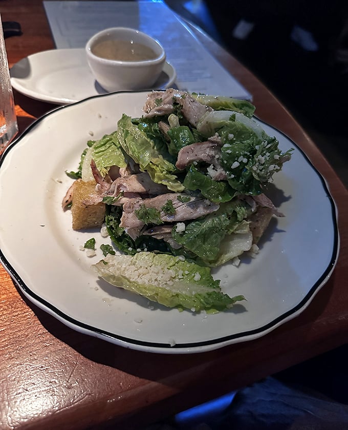 A Caesar salad that Julius himself would approve of—crisp romaine, rustic croutons, and chicken that didn't have a bad day.