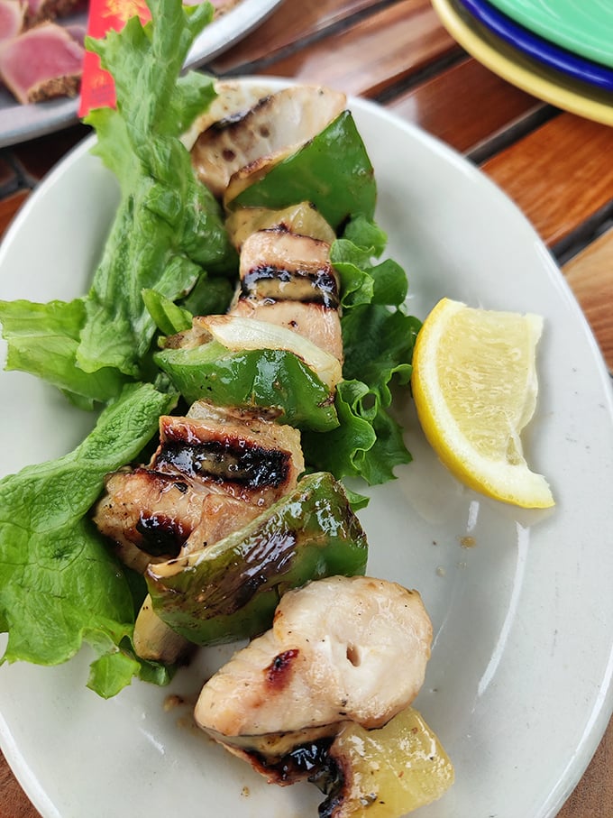 Protein on a stick—humanity's greatest culinary invention since fire itself. These kabobs showcase the grill master's art with a side of tropical flair. 