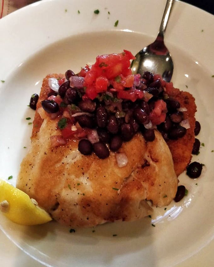 Simple perfection on a plate – this grilled fish topped with black bean salsa proves sometimes the best seasoning is restraint.