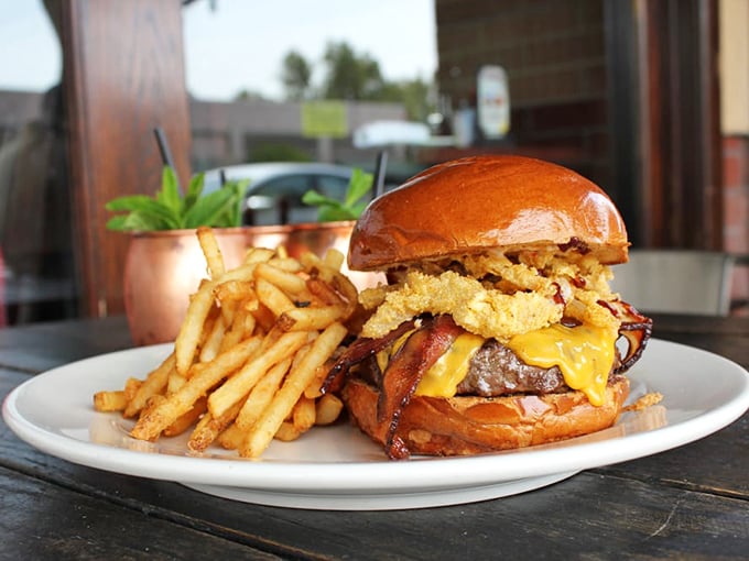 This isn't just a burger – it's an engineering marvel of beef, cheese, bacon, and those glorious onion strings. Napkins required, regrets impossible.