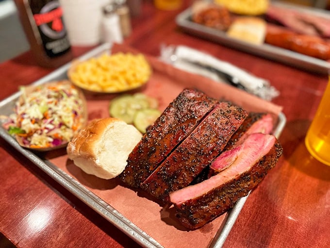 A plate that makes you forget table manners exist – perfectly smoked meats with sides that don't play second fiddle.