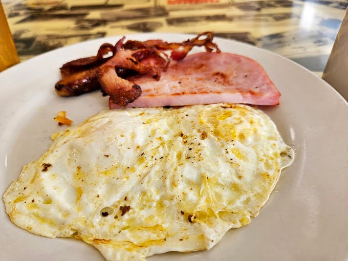 Sometimes the classics need no improvement. Perfectly cooked eggs with ham and bacon – the breakfast equivalent of a greatest hits album.