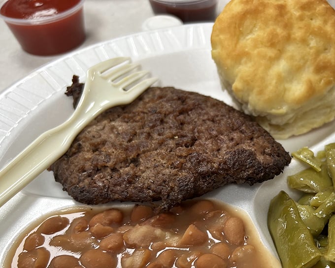 Country cooking that doesn't need Instagram filters – just honest-to-goodness hamburger steak, beans, and a biscuit that could make angels weep.