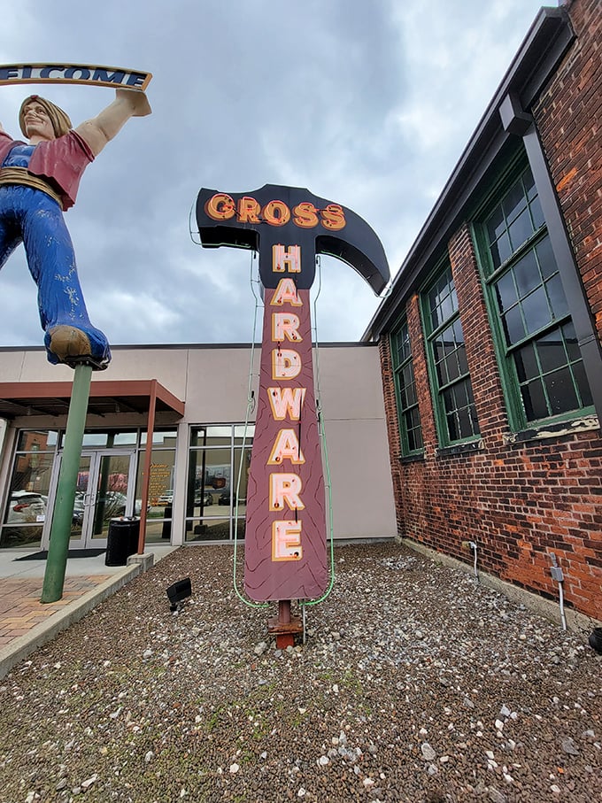 The "GROSS HARDWARE" sign stands tall – when hammers were hammers and signs were sculptural landmarks guiding travelers home.