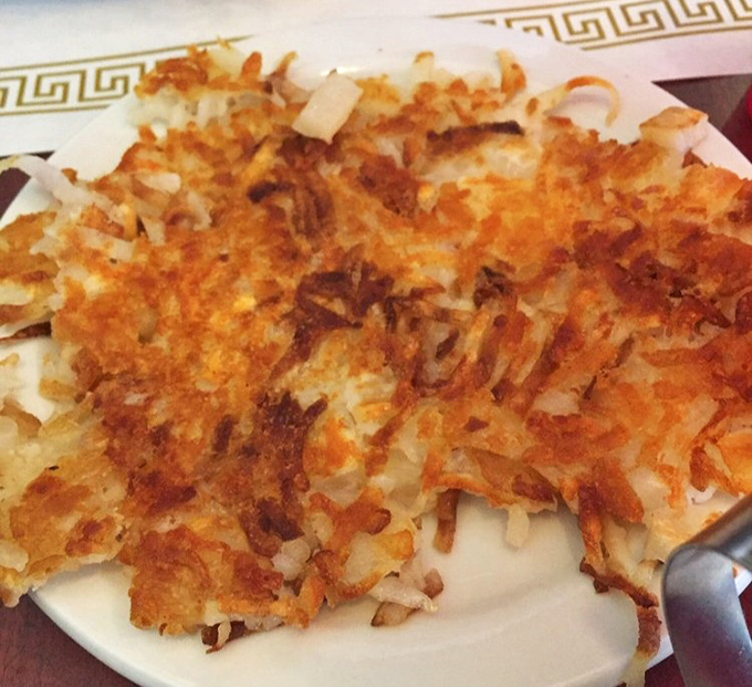 These hash browns deserve their own fan club—crispy exterior, tender interior, and that perfect golden-brown color that says "we know what we're doing here."