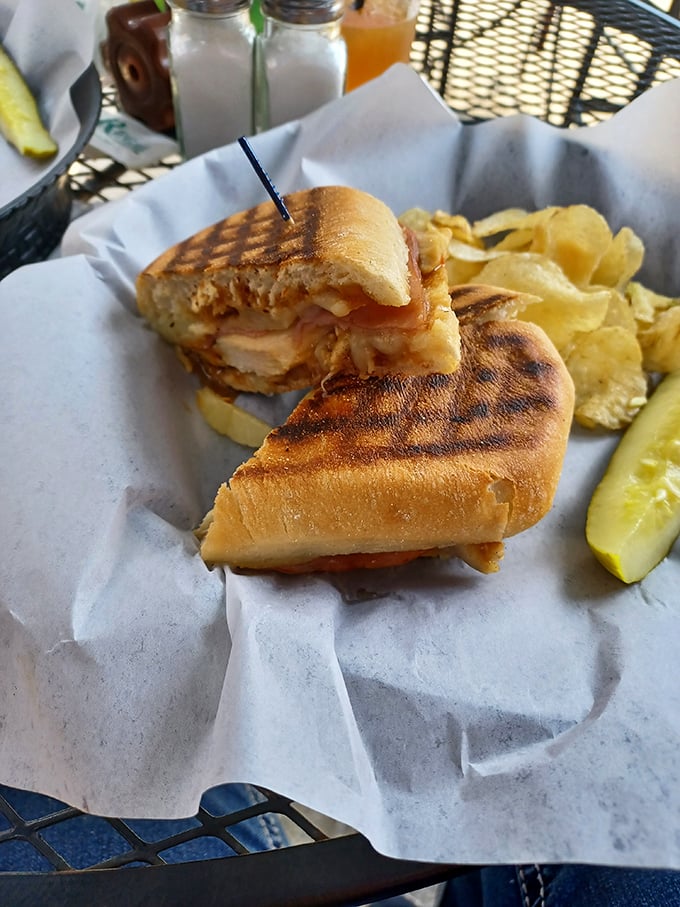 A pressed sandwich that's had more quality time with the grill than most people have with their therapists. Those house-made chips are the supporting actors who steal the scene.