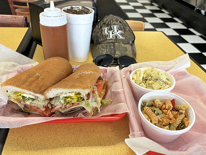 Sandwich diplomacy at its finest—bringing together crispy onion rings and a hearty sub that demands to be photographed before consumption.
