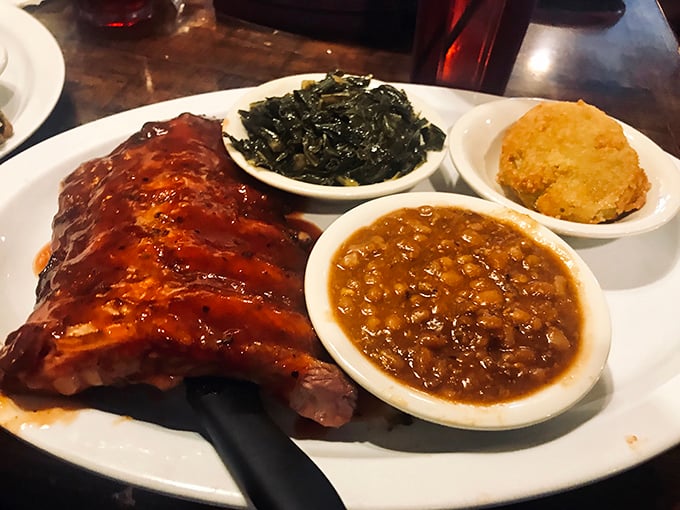 Barbecued ribs glistening with sauce alongside collard greens and beans – a holy trinity of Southern comfort that speaks to your soul.