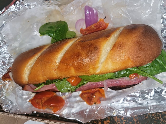 A sandwich that doesn't just satisfy hunger—it obliterates it. Fresh bread, vibrant veggies, and enough fillings to require an engineering degree to eat.