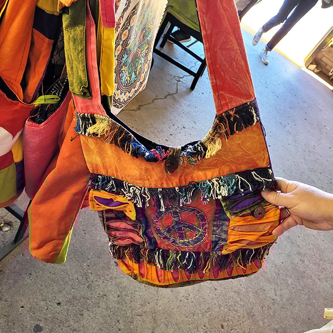 This vibrant peace-sign adorned bag isn't just an accessory – it's a time machine straight back to Woodstock with extra pockets for modern necessities.