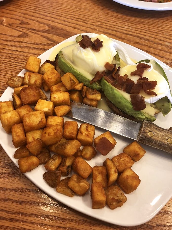 Home fries and avocado toast—a marriage so perfect it deserves its own reality show. The bacon bits are just showing off.