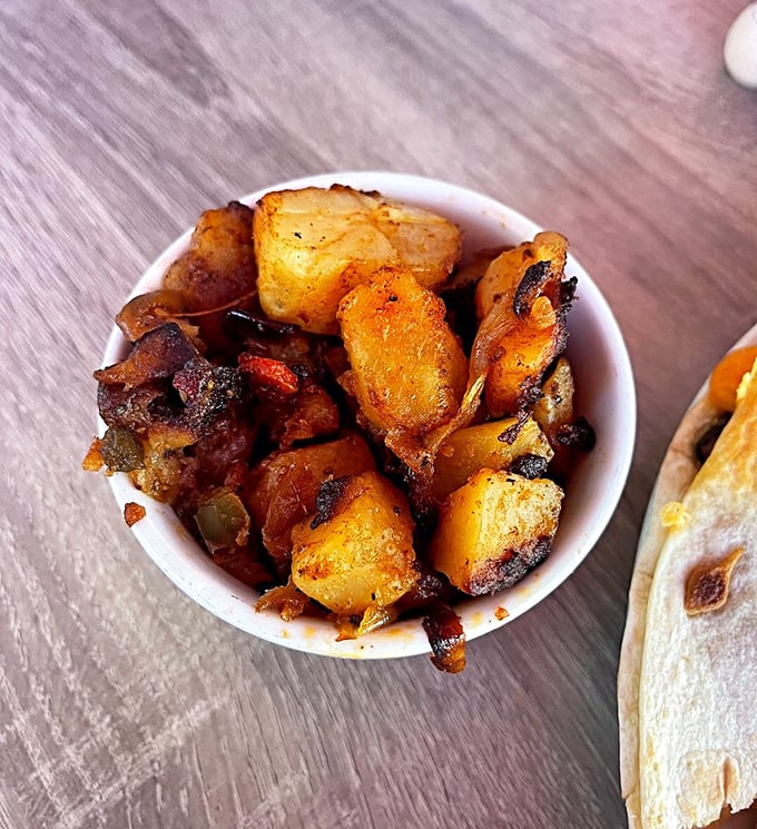 Home fries that have clearly found their forever home—crispy, seasoned, and ready to steal the spotlight from whatever main dish they're supposed to accompany.
