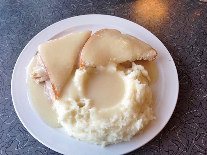 Comfort on a plate—tender turkey and cloud-like mashed potatoes swimming in gravy that could make a vegetarian reconsider their life choices.