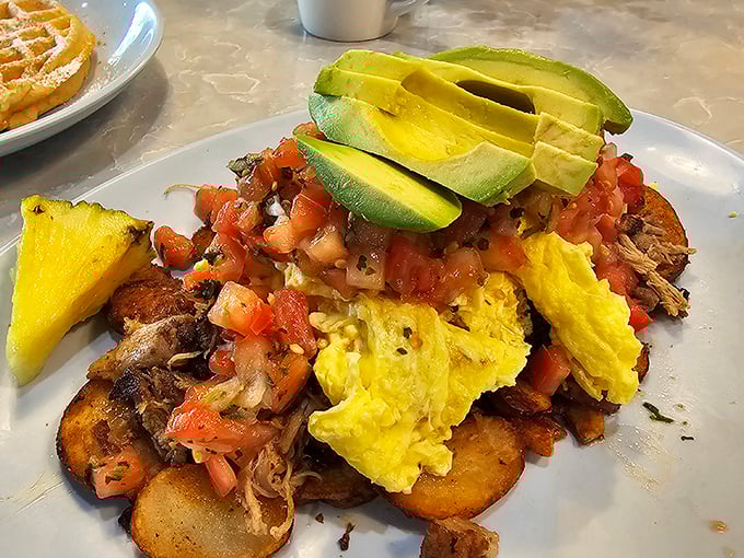 Huevos rancheros reimagined with Florida flair—where scrambled eggs meet fresh pico de gallo in a vacation romance that lasts longer than your suntan.