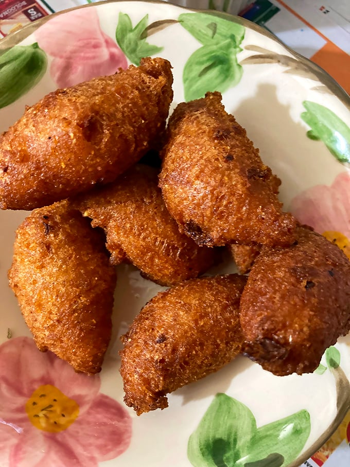 Golden-brown hushpuppies with crispy exteriors hiding fluffy, cornmeal interiors—the unsung heroes of any proper Southern barbecue feast.