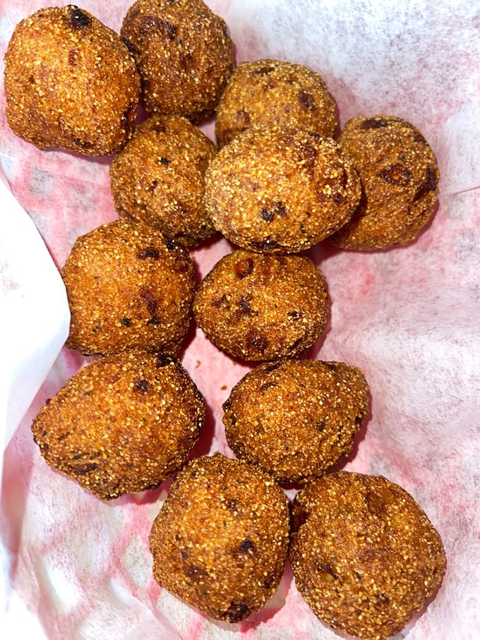 Hush puppies so golden and perfect they deserve their own Instagram account. Crispy exterior, tender cornmeal interior – seafood's perfect sidekick.