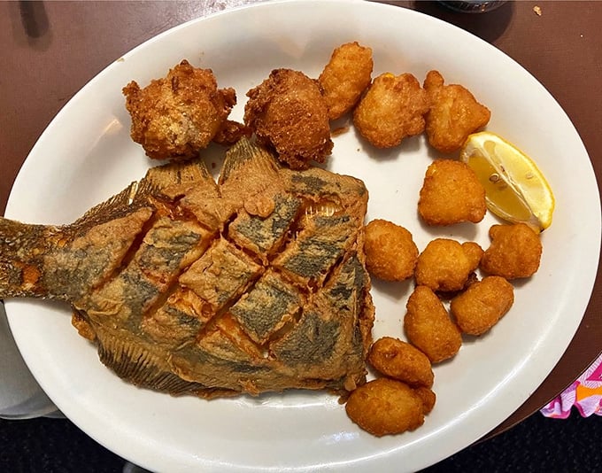That whole fish staring back at you isn't judging your table manners—it's just surprised you found this hidden gem. The crispy skin hides tender, flaky perfection.