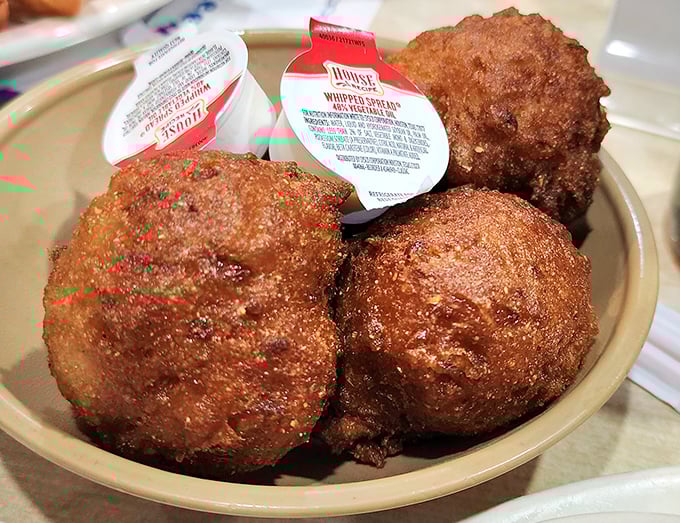Hush puppies so perfect they deserve their own fan club. These golden orbs of cornmeal goodness are what carb dreams are made of.