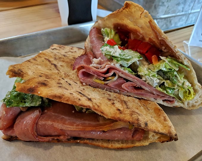 The Italian sandwich doesn't just satisfy hunger—it resolves it with layers of cured meats and fresh greens tucked into perfectly charred bread.