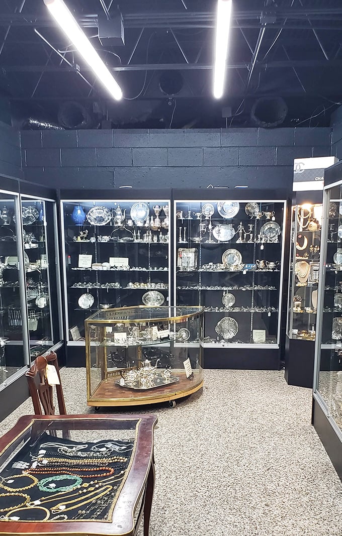 The silver section gleams like a miniature museum where every cake server and tea strainer awaits its second act in your dinner party dramas. 