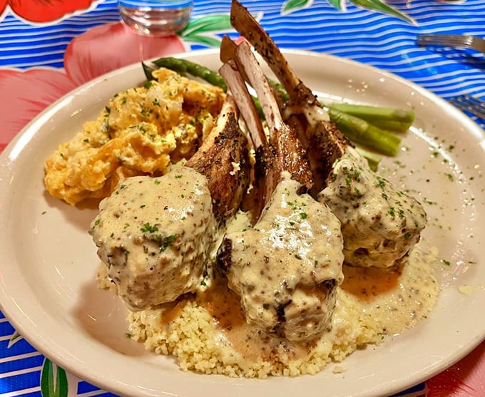 These lamb chops aren't just dinner—they're architecture, standing proudly in their creamy sauce like delicious monuments to Midwestern culinary craftsmanship.