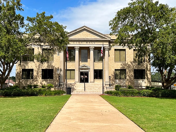 Leesburg's City Hall commands respect with its classical columns and symmetry—civic pride in architectural form, framed by Florida's impossibly blue sky.