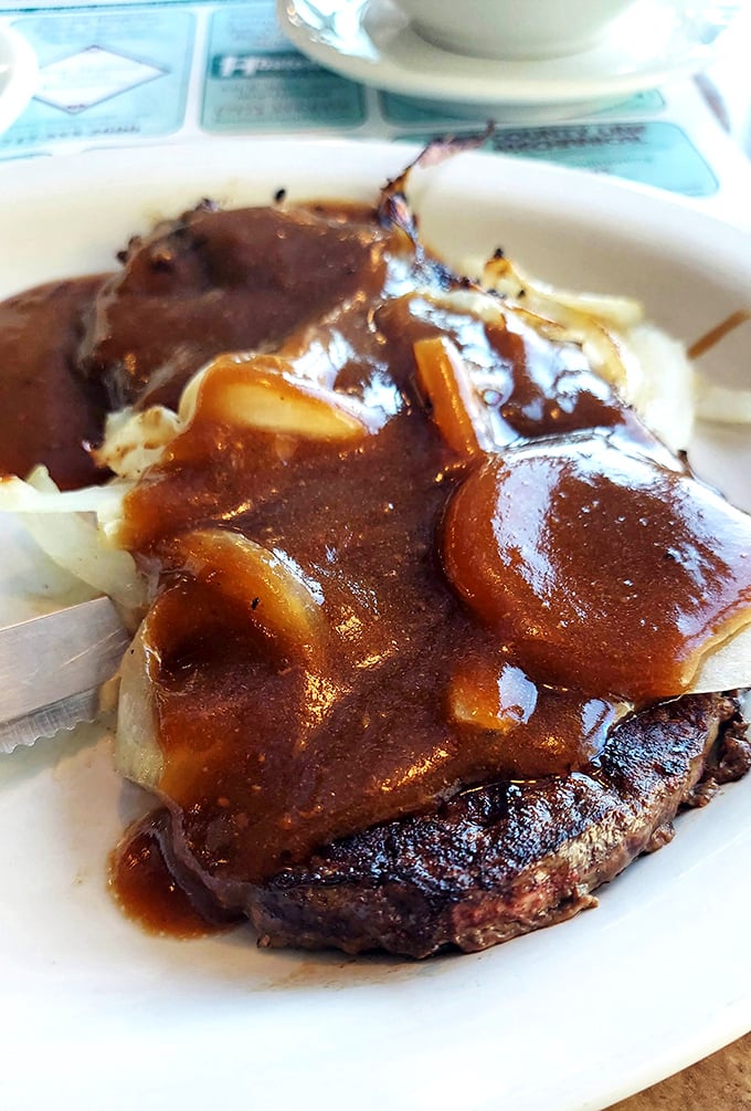 Liver and onions swimming in gravy that could make converts of the skeptics. This isn't just food—it's a declaration of traditional values. 