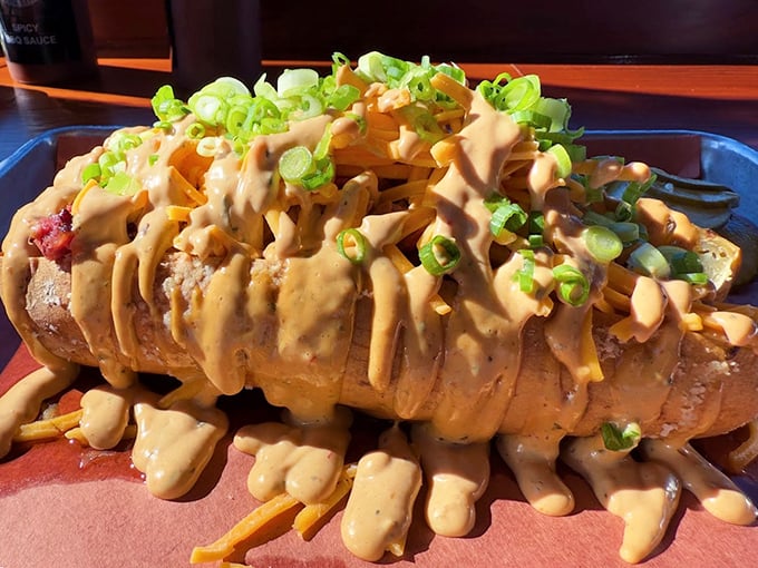 The "Dirty Frites" – where French fries meet their destiny under a blanket of cheese sauce, brisket, and chipotle aioli.