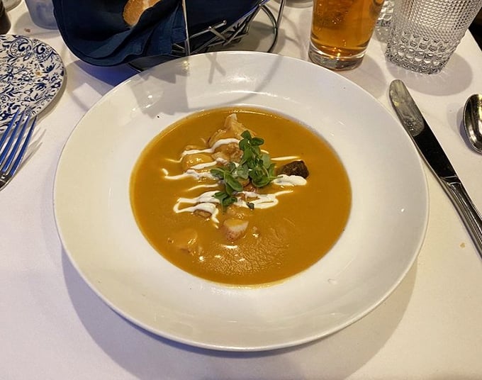 This lobster bisque isn't just soup—it's a copper-hued sonnet to the sea, with cream and sherry playing backup to the star ingredient.