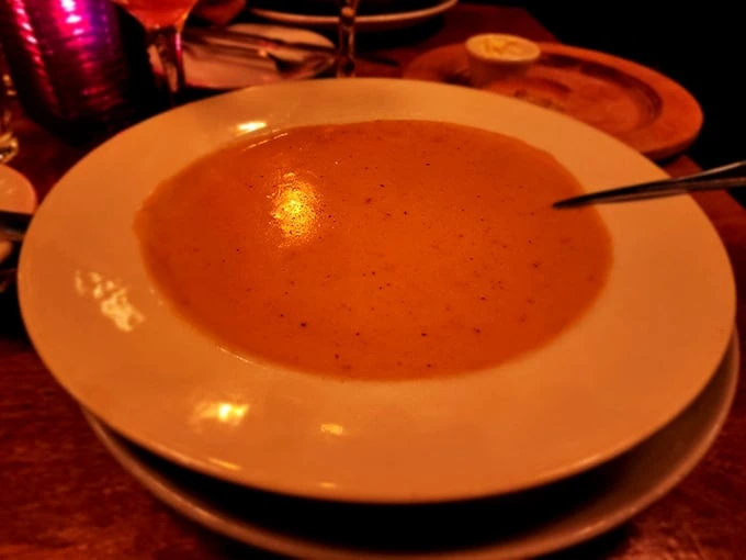 A silky bisque that whispers sweet nothings about the ocean with each spoonful—lobster never had it so good.