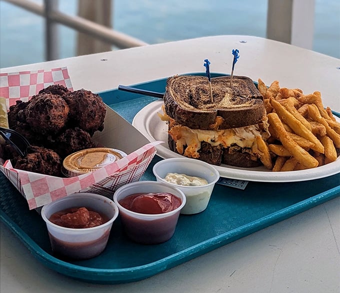 The legendary Lobster Reuben—where New York deli tradition meets Keys seafood innovation—creates a sandwich worth driving across state lines for.