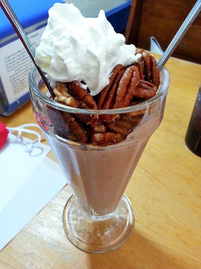 This isn't just a milkshake—it's a time machine in a glass, topped with enough pecans to make a squirrel jealous.